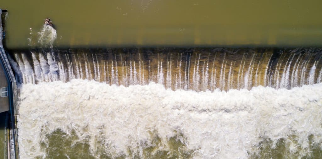 What Should You Do When Approaching A Low-Head Dam In A Canoe Or Kayak?